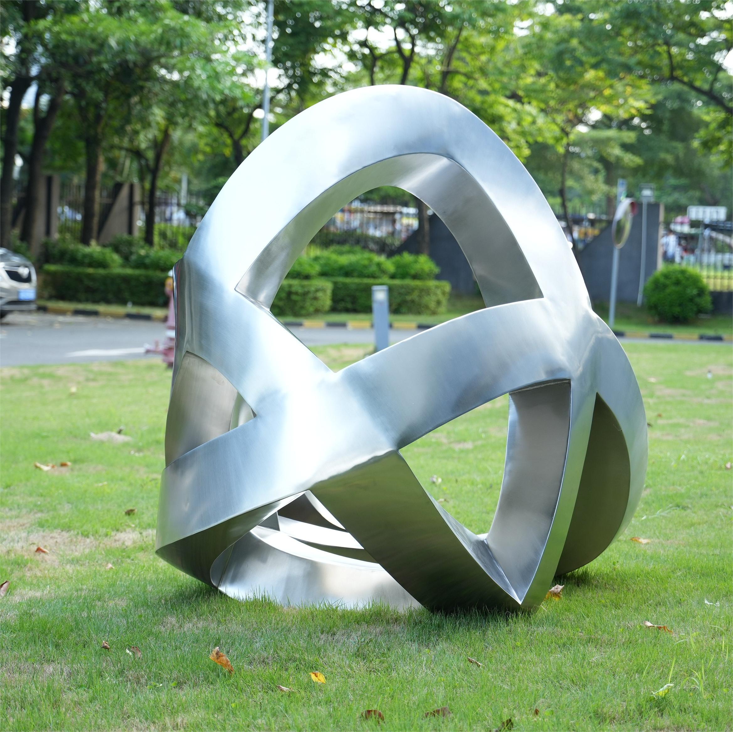 Stainless steel abstract ribbon-wrapped sculpture - Metal Sculpture ...