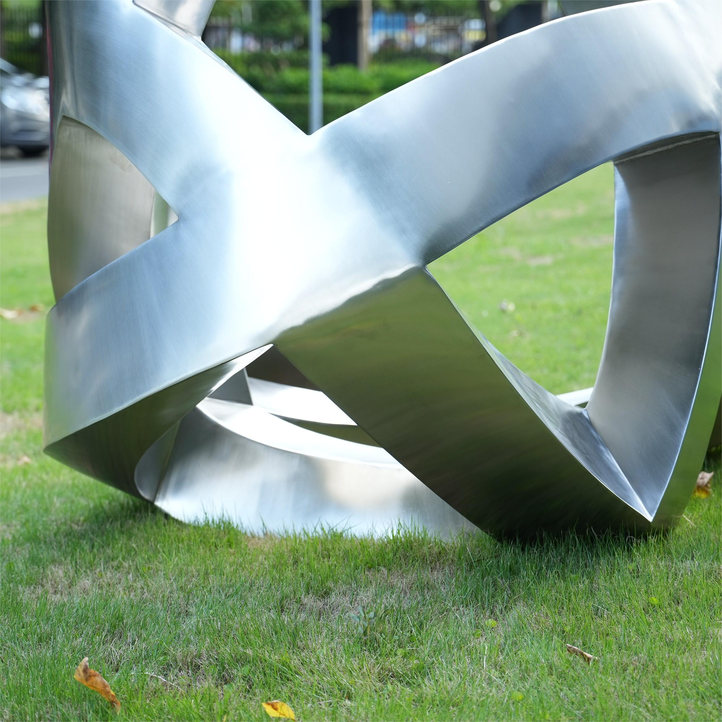 Stainless steel abstract ribbon-wrapped sculpture - Metal Sculpture ...