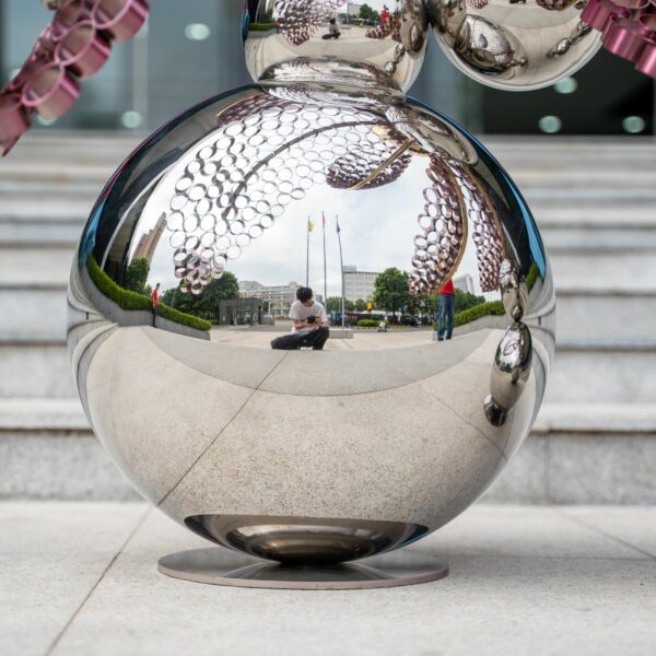 Outdoor abstract sculpture art: the harmonious dance of flowers and ...